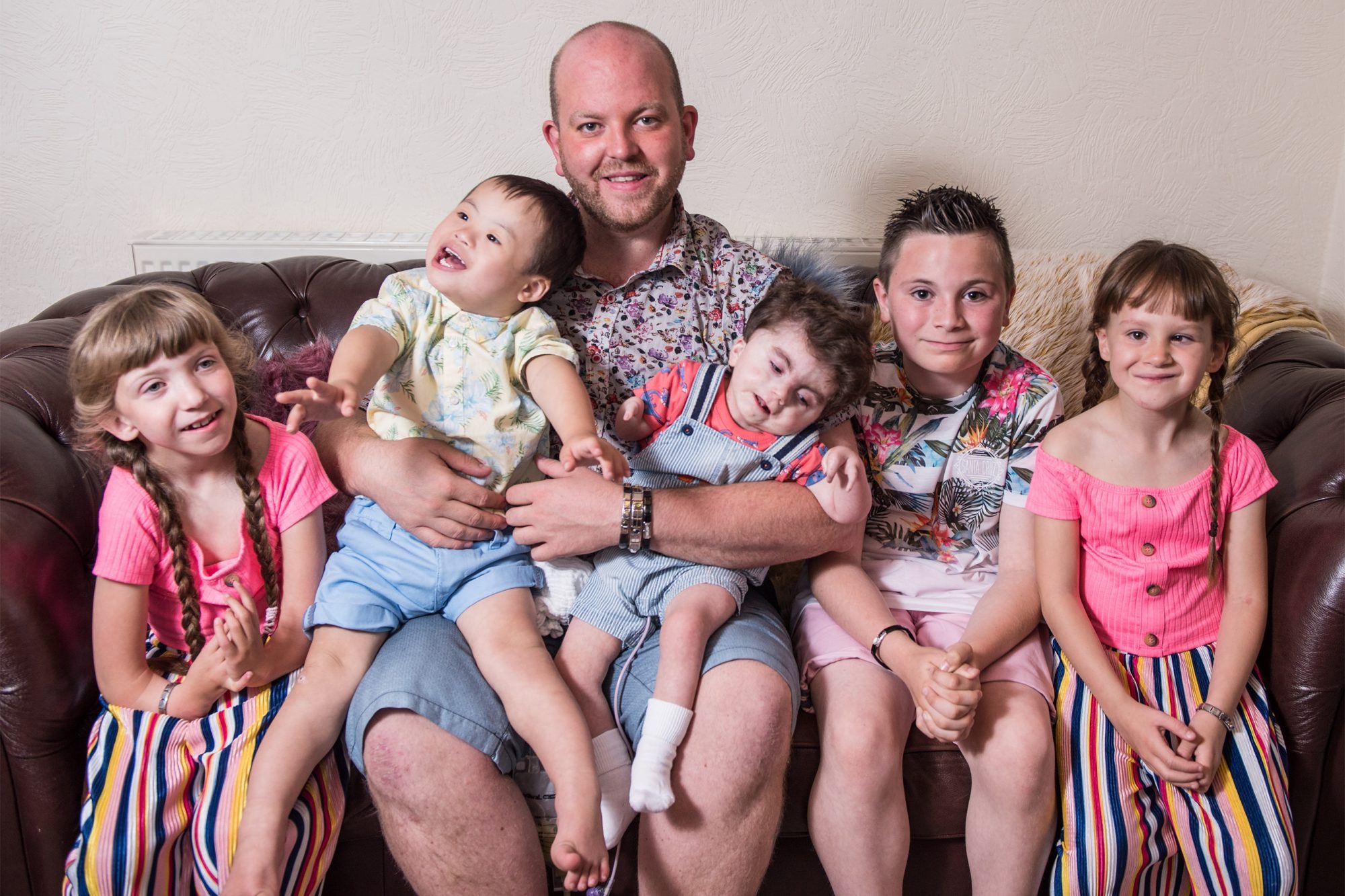 Dad who is single adopts six disabled children: "I would never say ...
