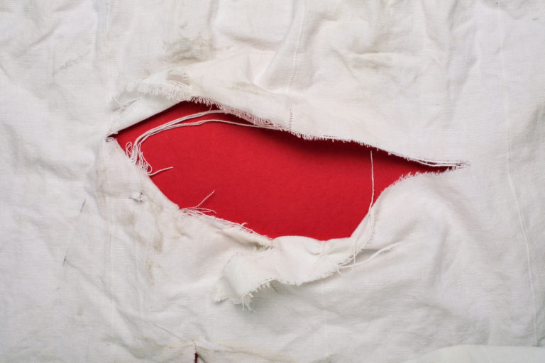 A No-Sew Trick To Fix a Hole in Clothing